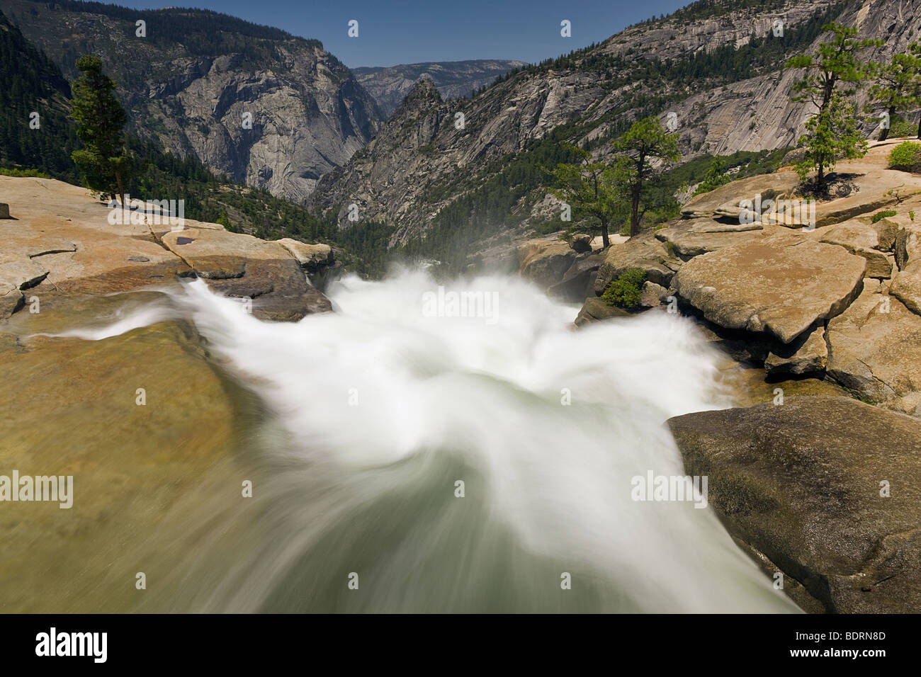 The Merced River flows out of Little Yosemite Valley over the top of ...