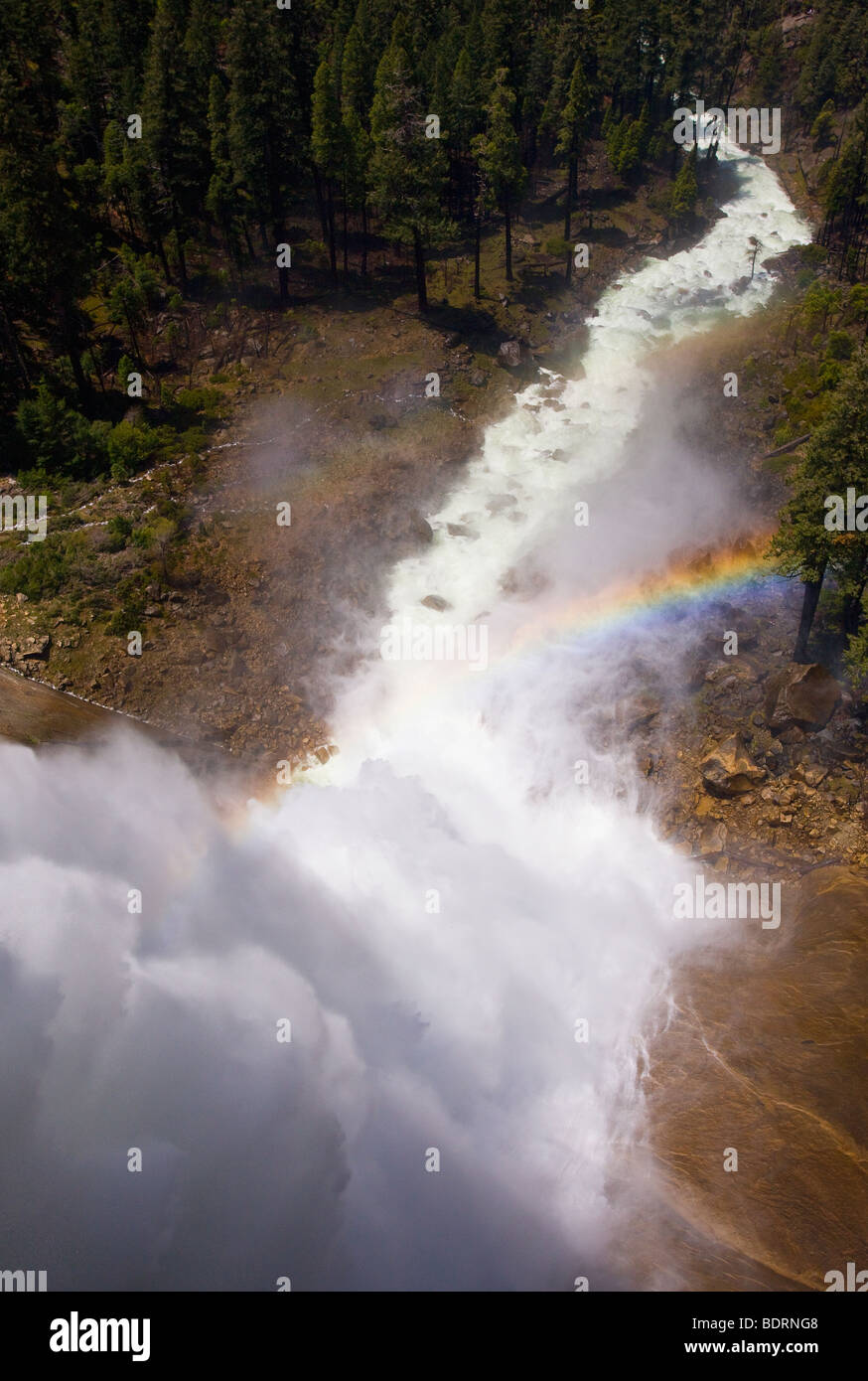 Nevada Fall's explosion of mist creates an arcing rainbow. Yosemite ...