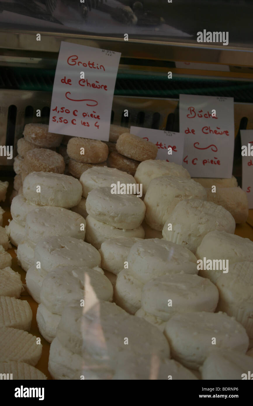 Crottin de chevre (goat cheese) sold at the weekly market in Lectoure ...