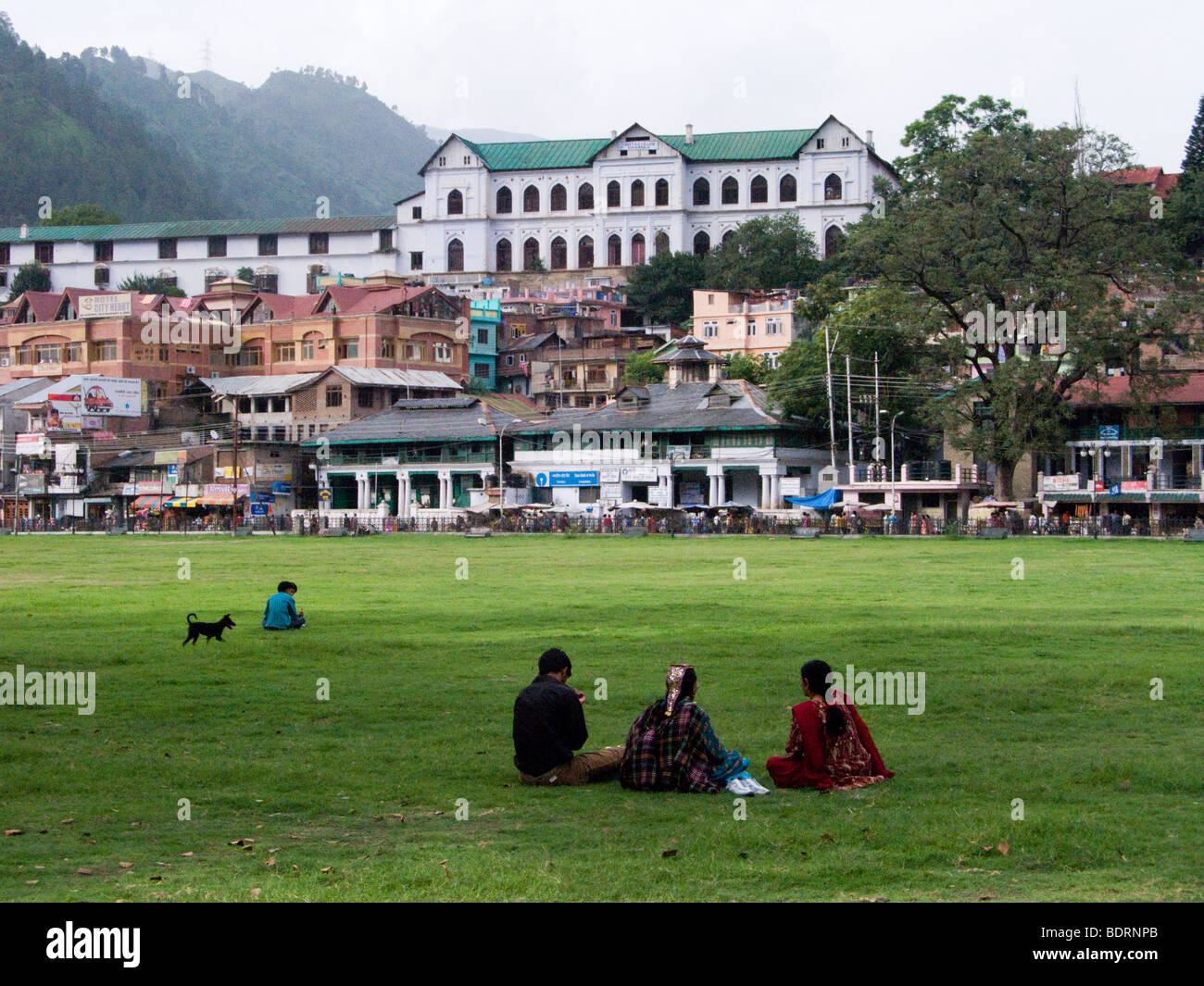 Indian people relaxing on the Chowgan (green area) in front of ...