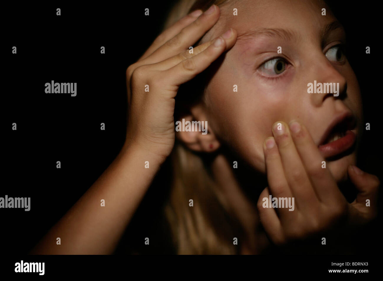 Young girl touching face, close-up Stock Photo - Alamy