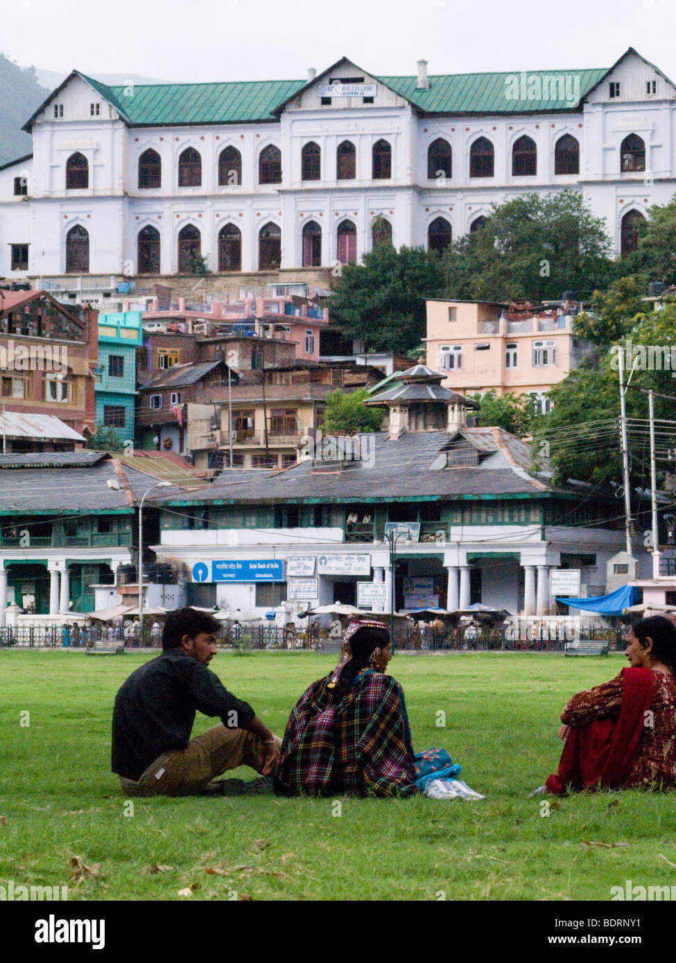 Indian people relaxing on the Chowgan (green area) in front of ...