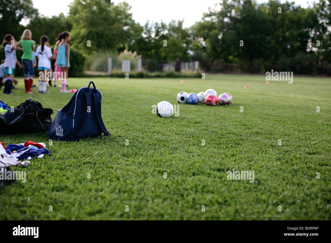 Girls playing soccer at field Stock Photo - Alamy