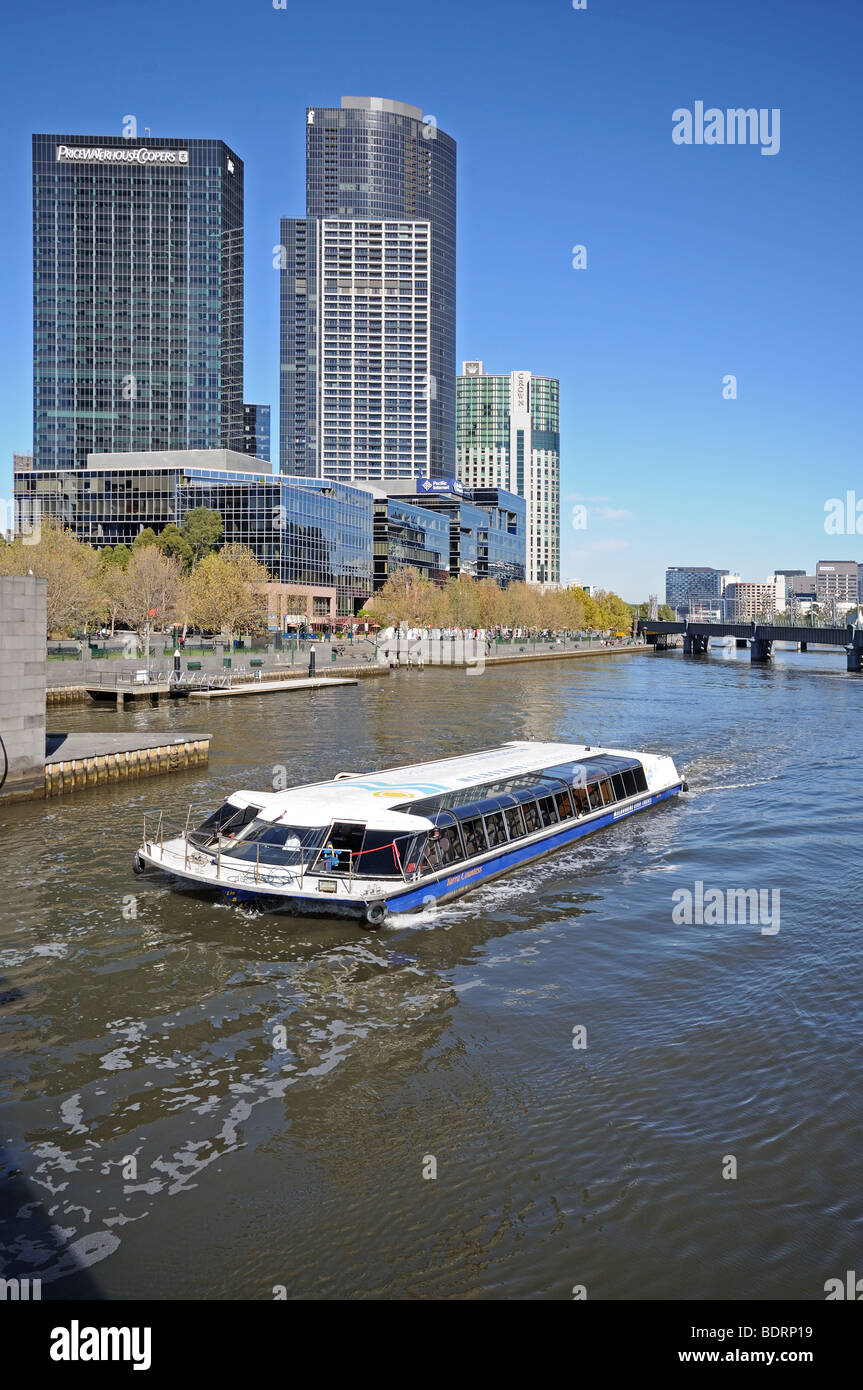 Melbourne River cruises and high rise buildings on banks of Yarra River ...