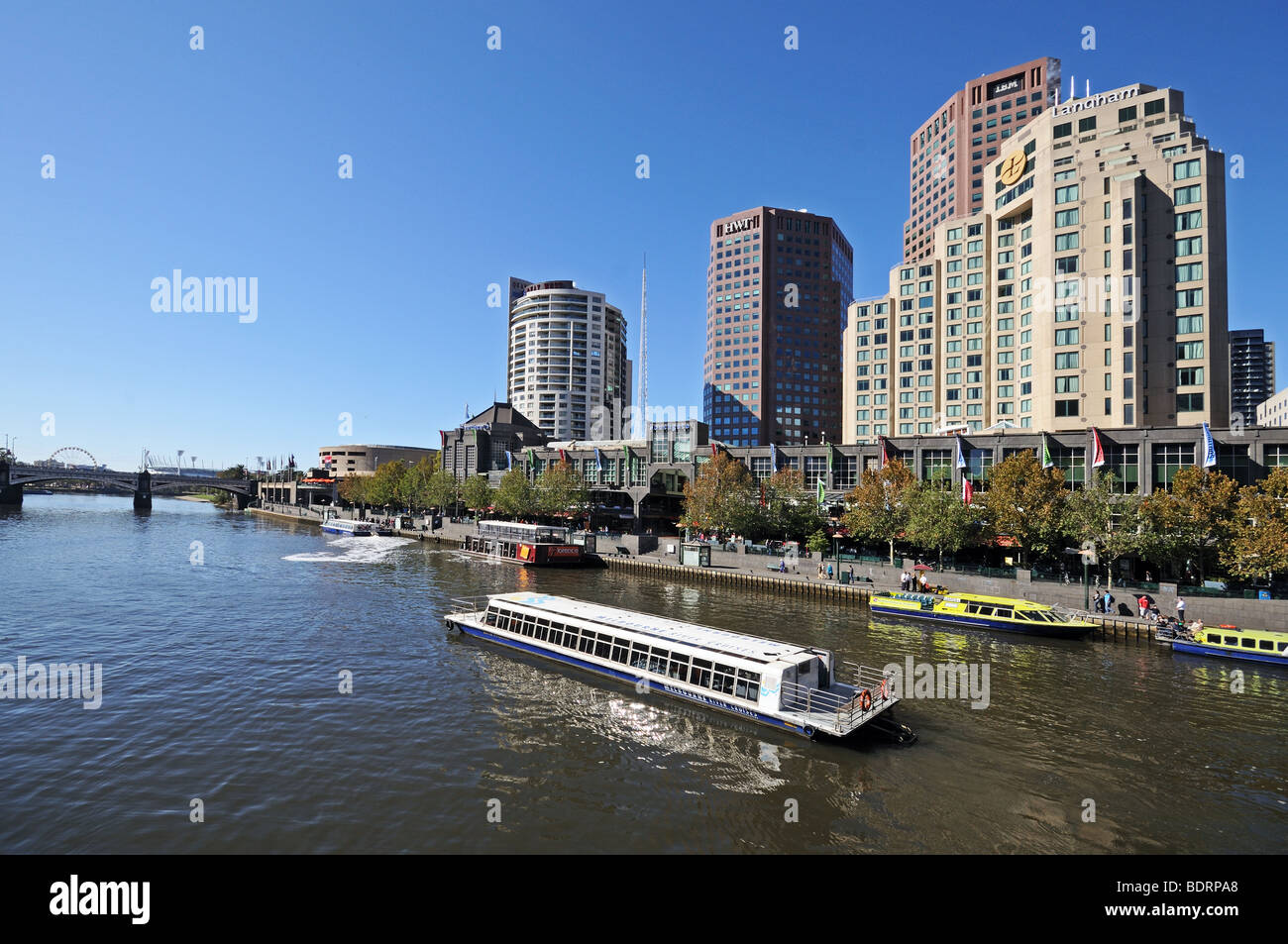 Melbourne River cruises and high rise buildings on banks of Yarra River ...