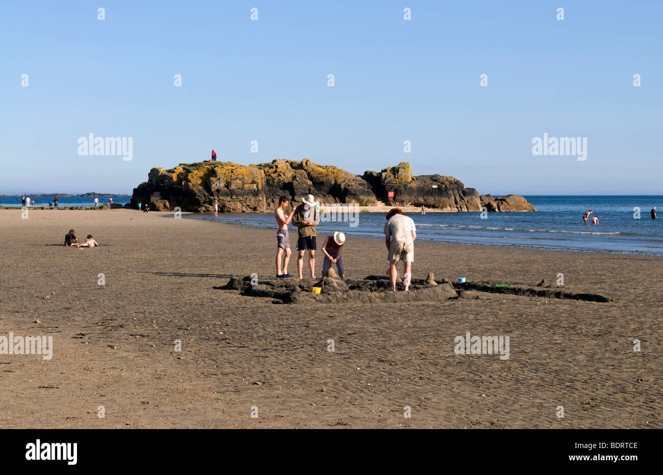 People building sand castles on Marazion beach in Cornwall, England ...