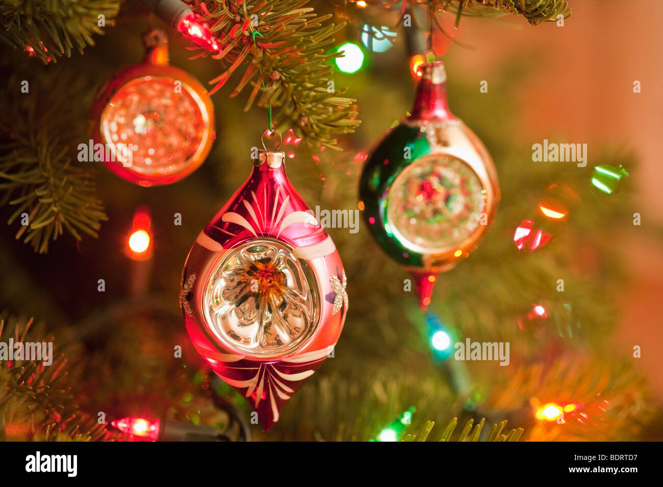 Christmas ornaments and lights on a Christmas tree Stock Photo - Alamy