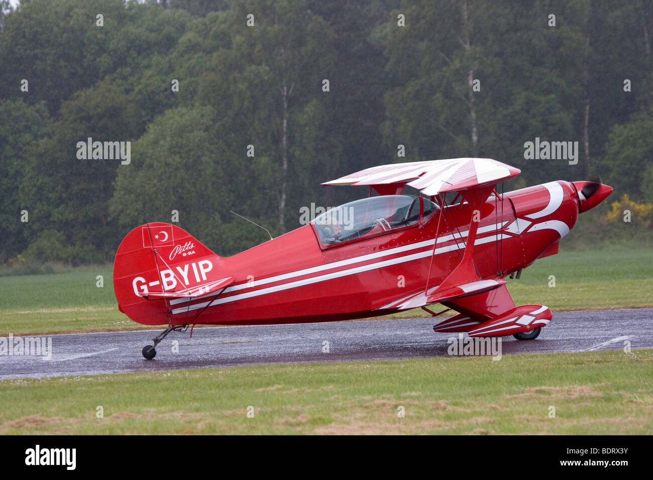 Pitts S-2A Special two seat aerobatic biplane taxiing along runway ...
