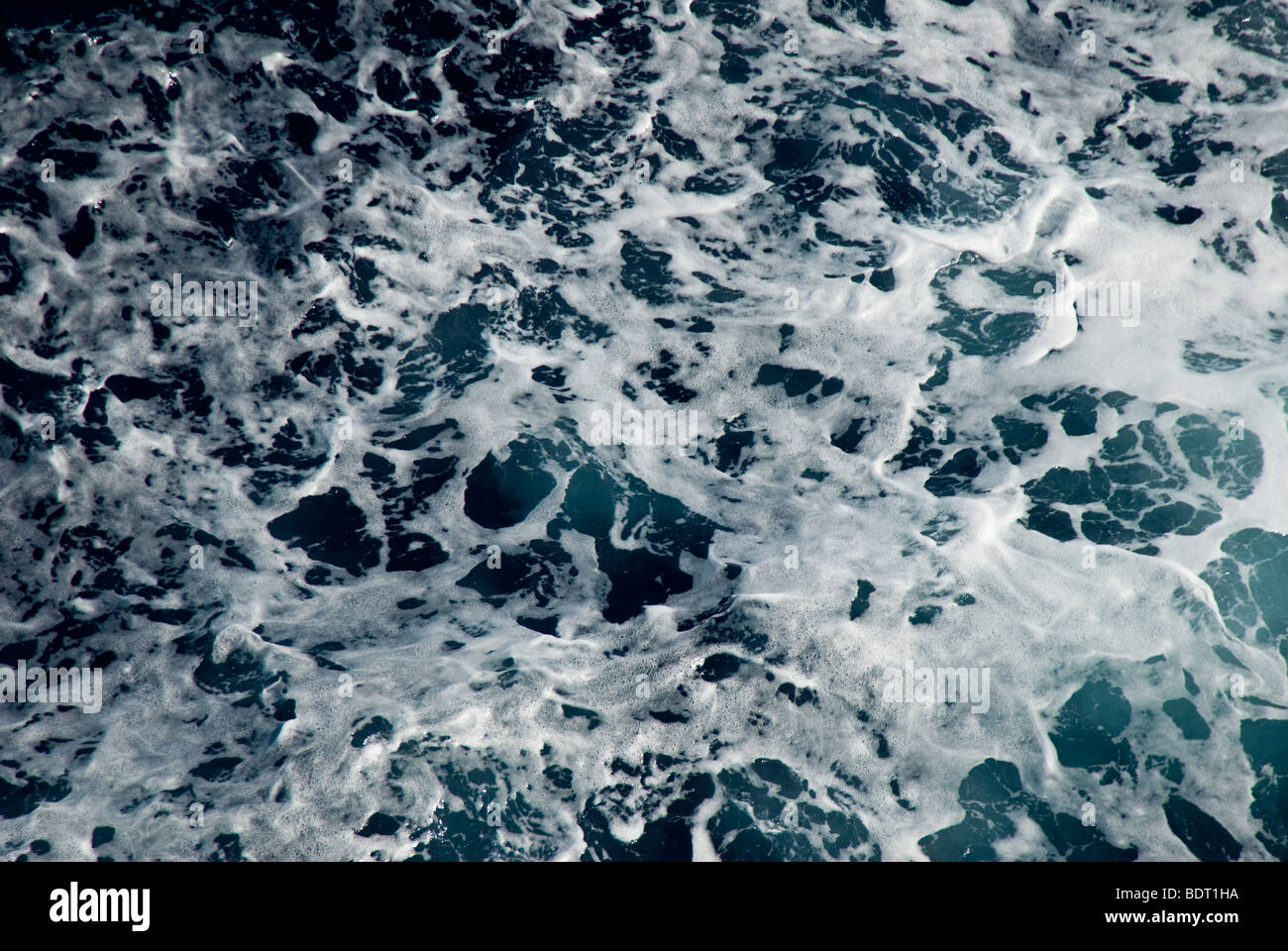 Blue sea and surf Stock Photo - Alamy