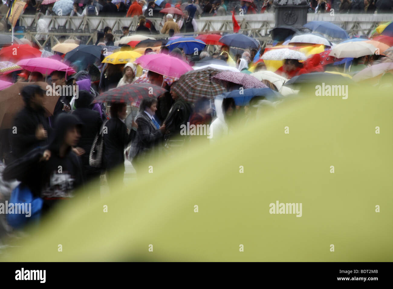 crowd of people with umbrellas in heavy rain in city town Stock Photo ...