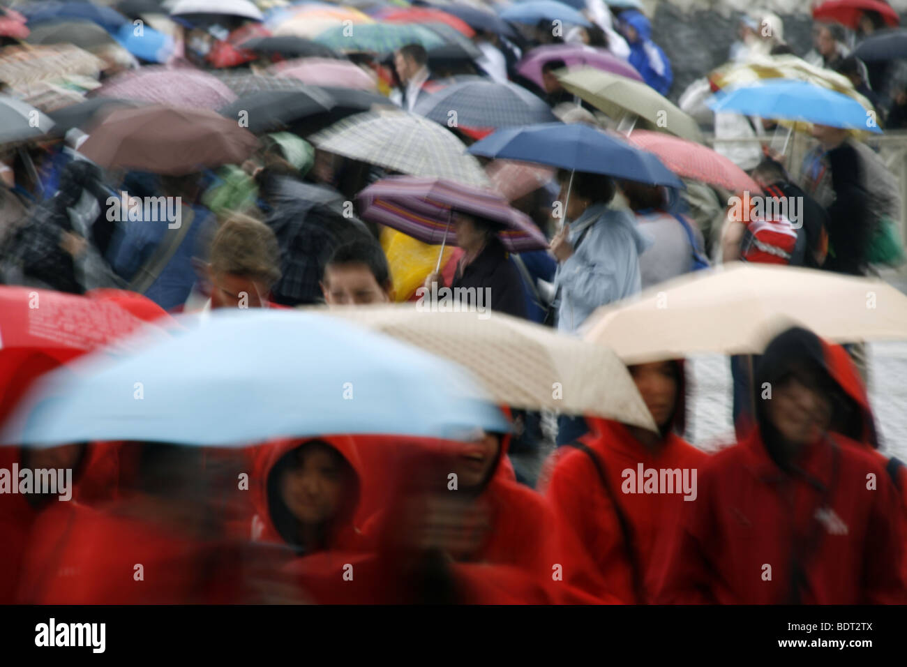 crowd of people with umbrellas in heavy rain in city town Stock Photo ...