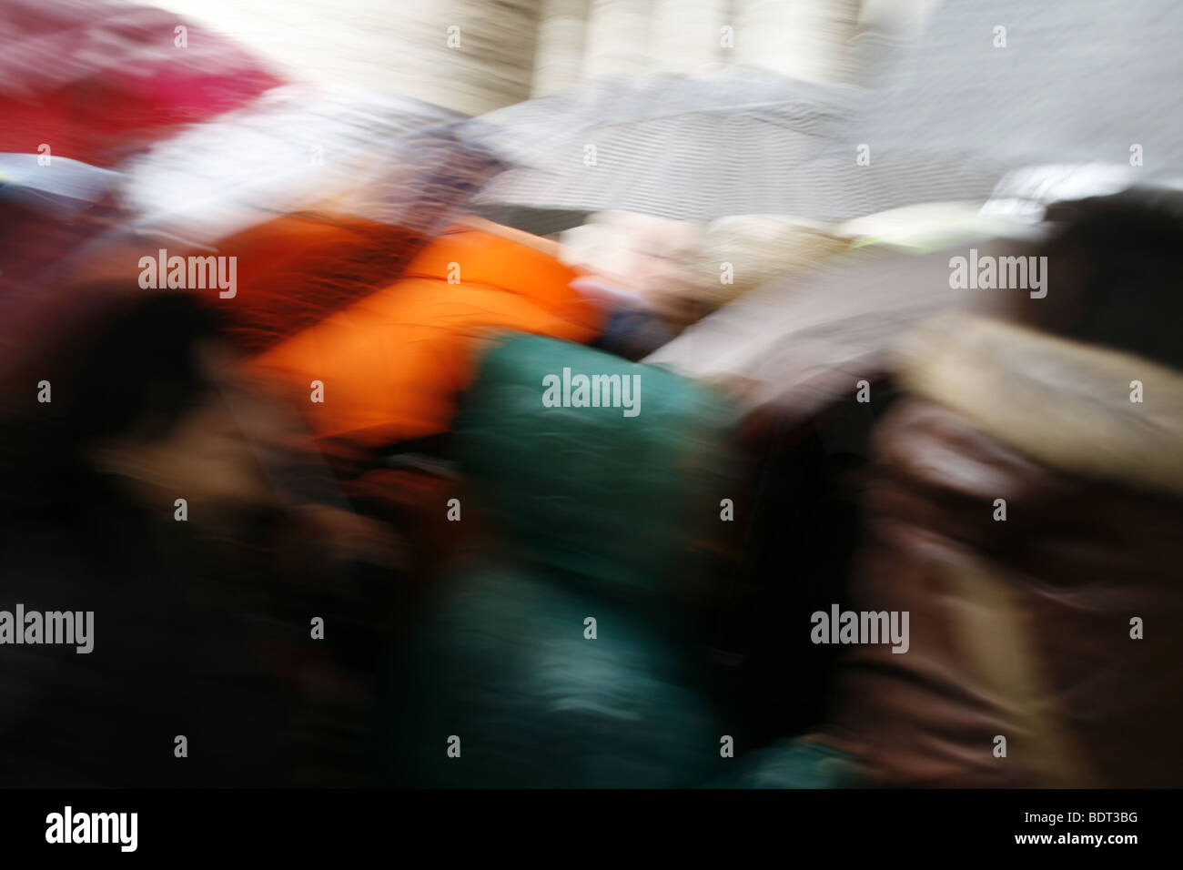 crowd of people with umbrellas in heavy rain in city town Stock Photo ...