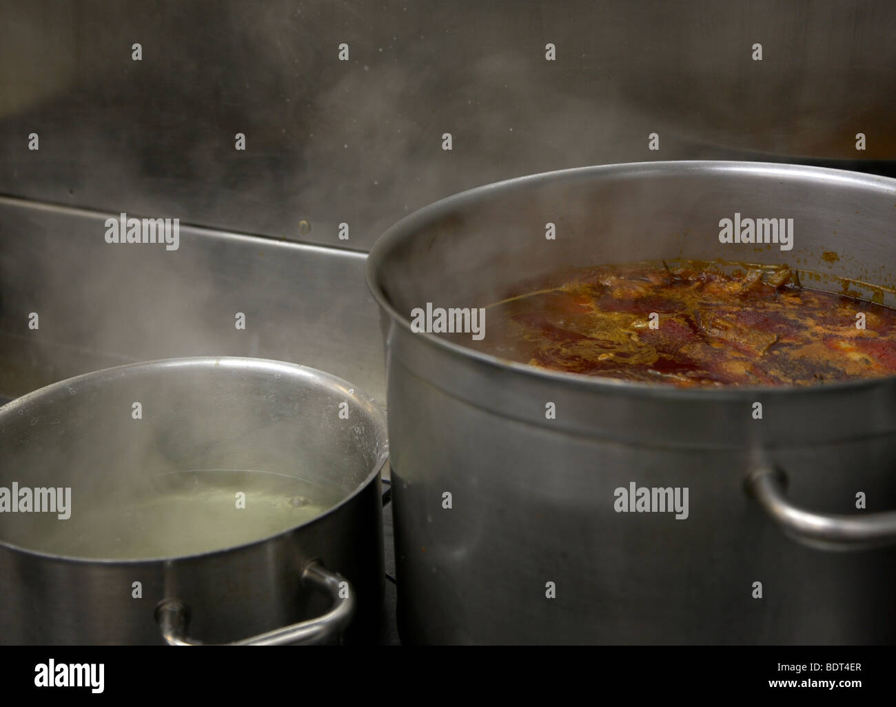 pot and pans cooking stock in Maze restaurant kitchen Stock Photo - Alamy