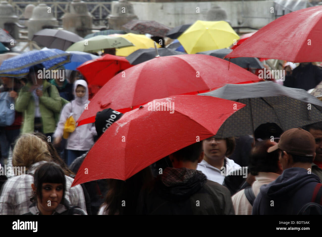 crowd of people with umbrellas in heavy rain in city town Stock Photo ...