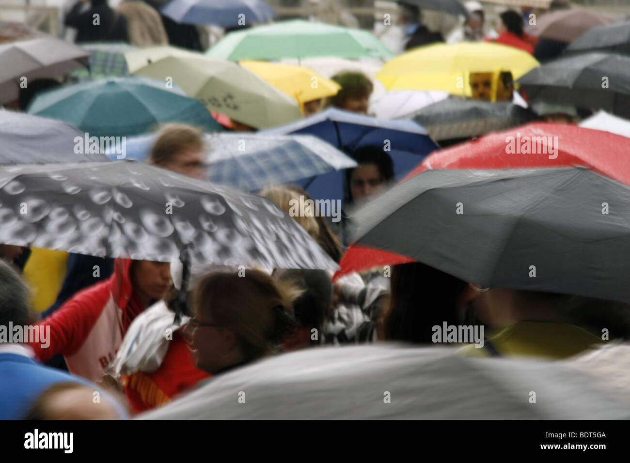 crowd of people with umbrellas in heavy rain in city town Stock Photo ...