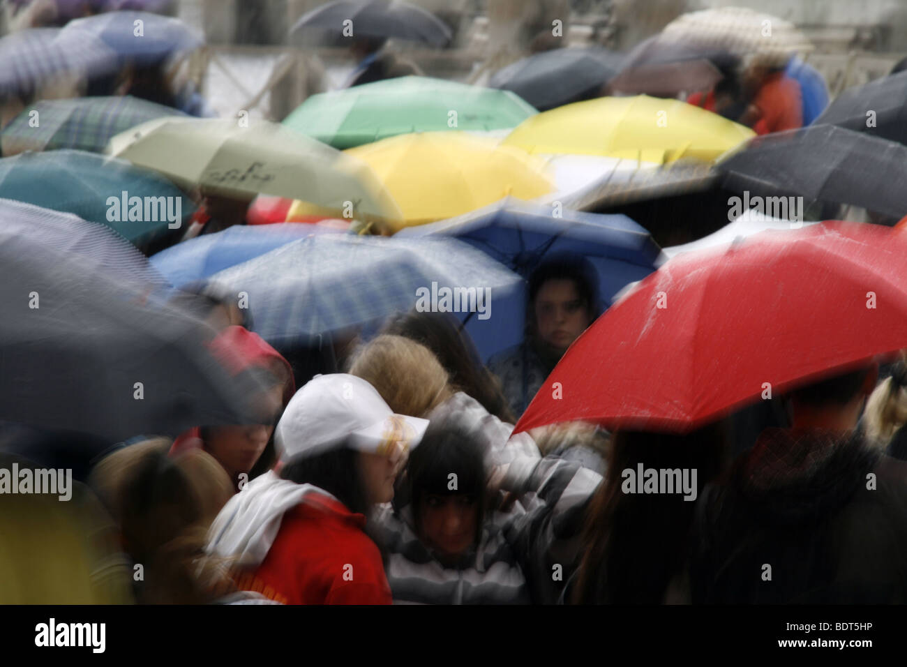 crowd of people with umbrellas in heavy rain in city town Stock Photo ...