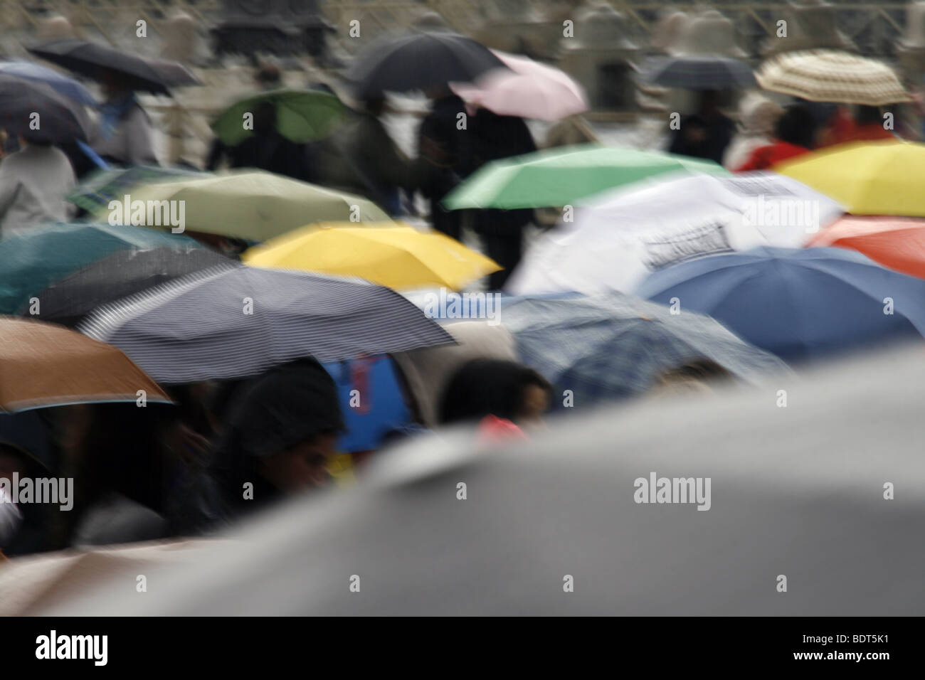 crowd of people with umbrellas in heavy rain in city town Stock Photo ...