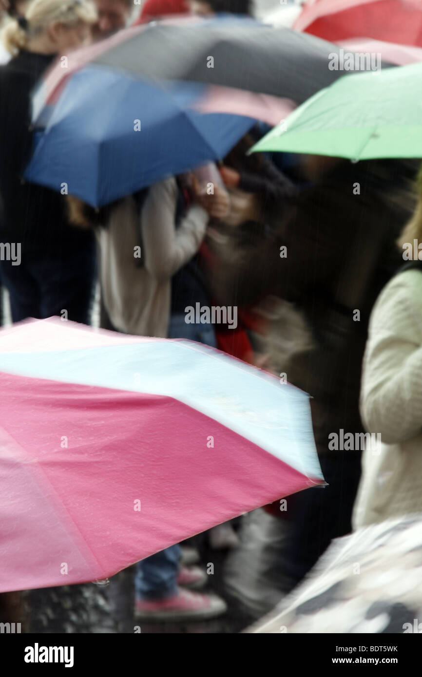 Queue line umbrella crowd people tourists bright hi-res stock ...