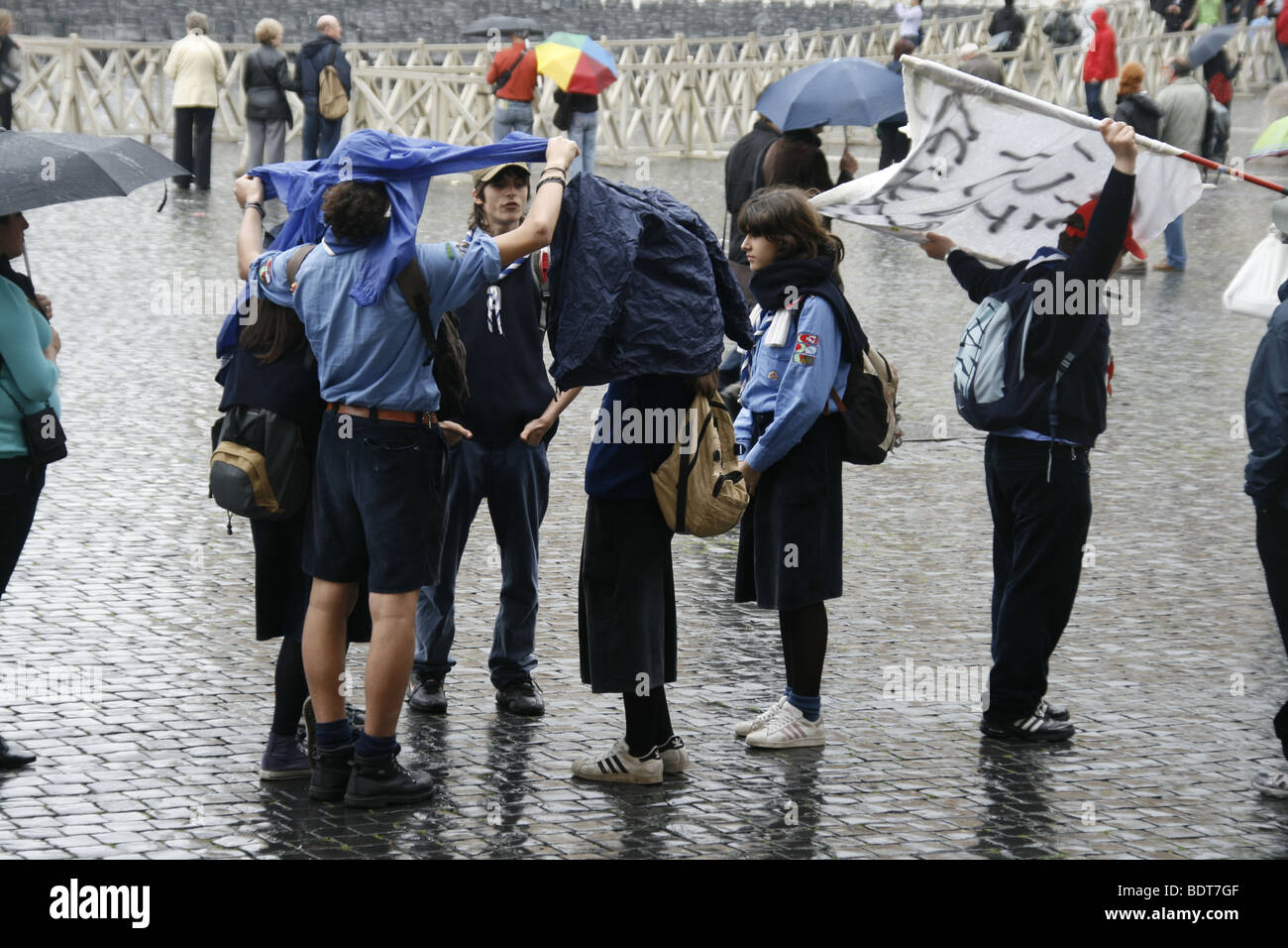 scout group tourists in a queue in heavy rain in vatican, rome Stock ...