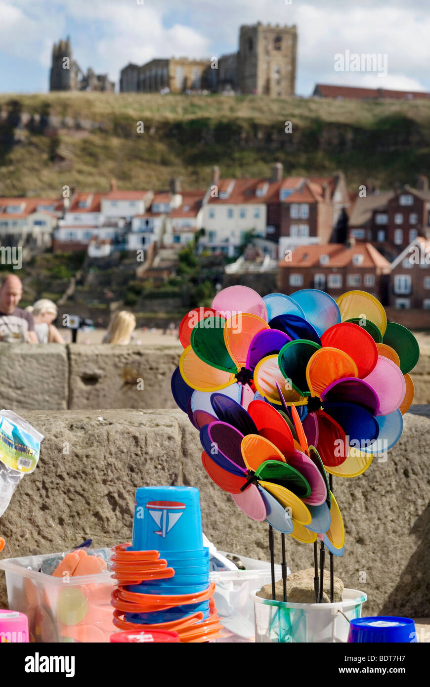 Whitby East Side and Whitby Abbey with children's seaside toys Stock ...