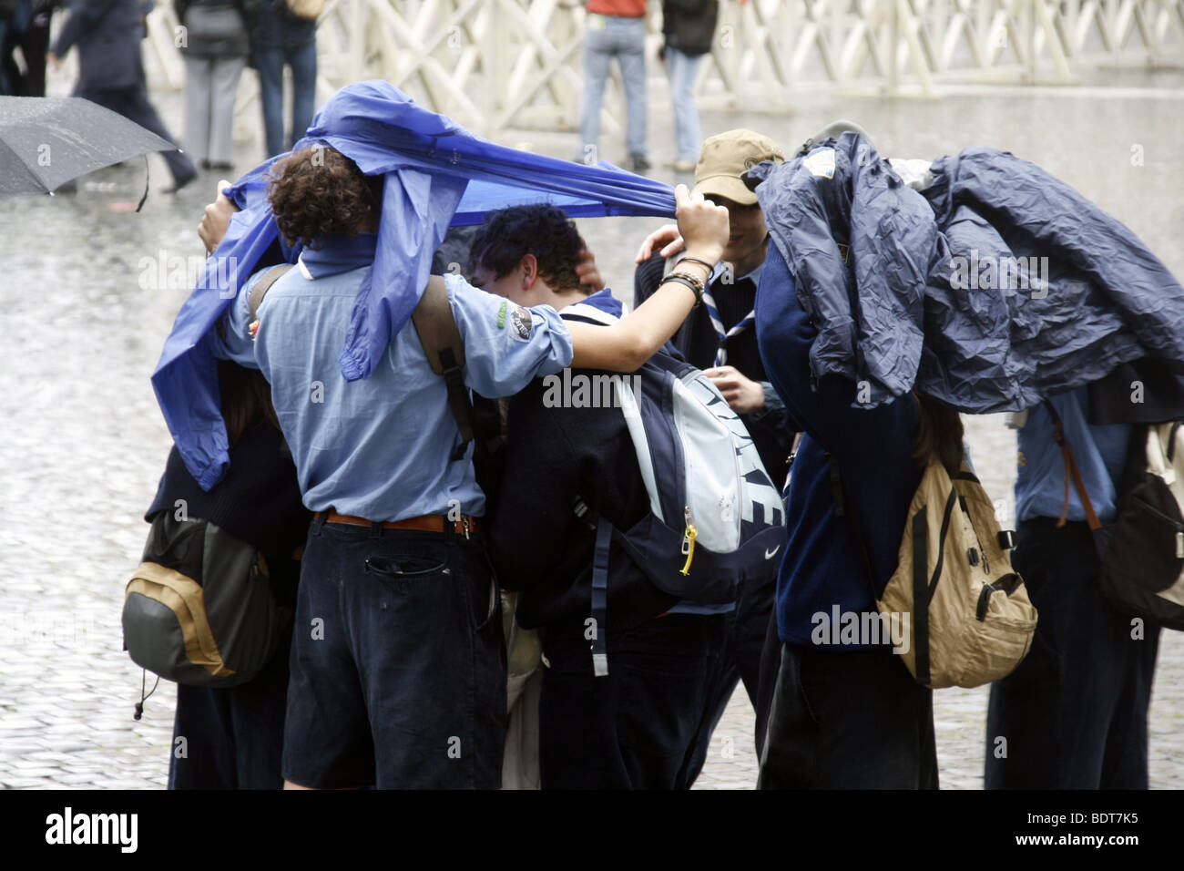 scout group tourists in a queue in heavy rain in vatican, rome Stock ...