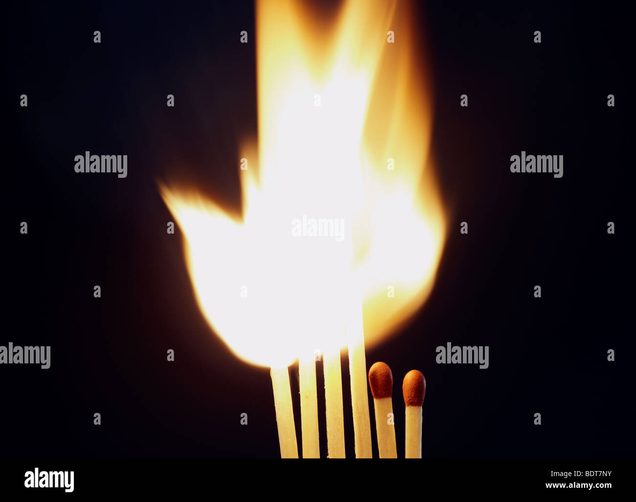 bright flame as four matches are set on fire whilst two shorter ones ...