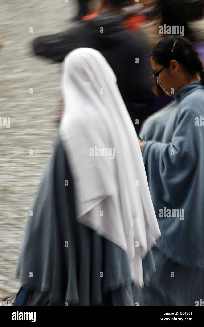 nun walking in street in the vatican, rome Stock Photo - Alamy