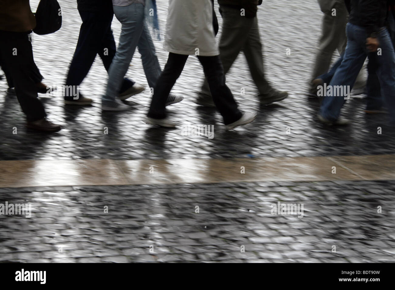 fast speed feet legs walking in street in town Stock Photo - Alamy