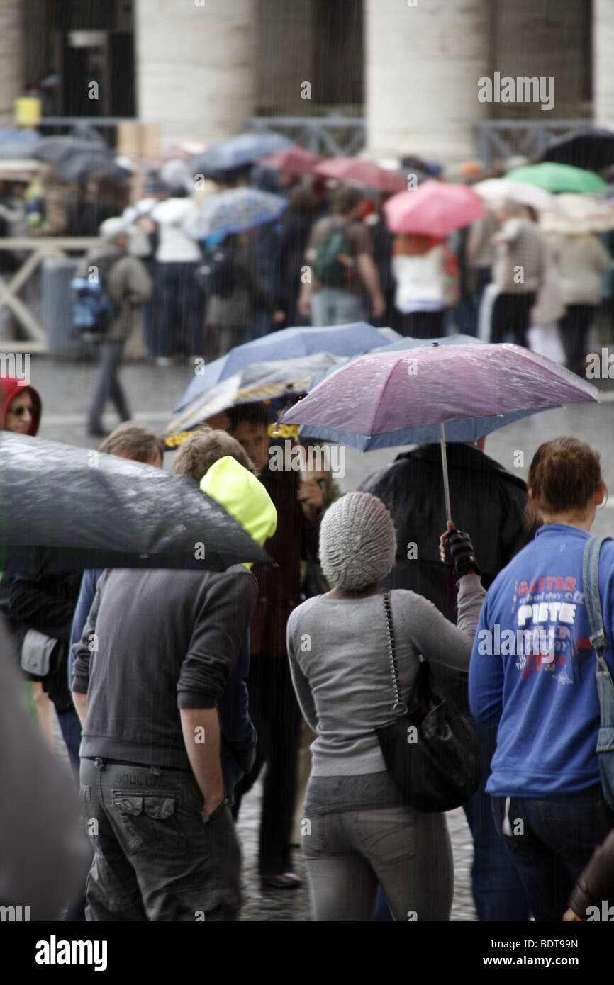 crowd of people with umbrellas in heavy rain in city town Stock Photo ...