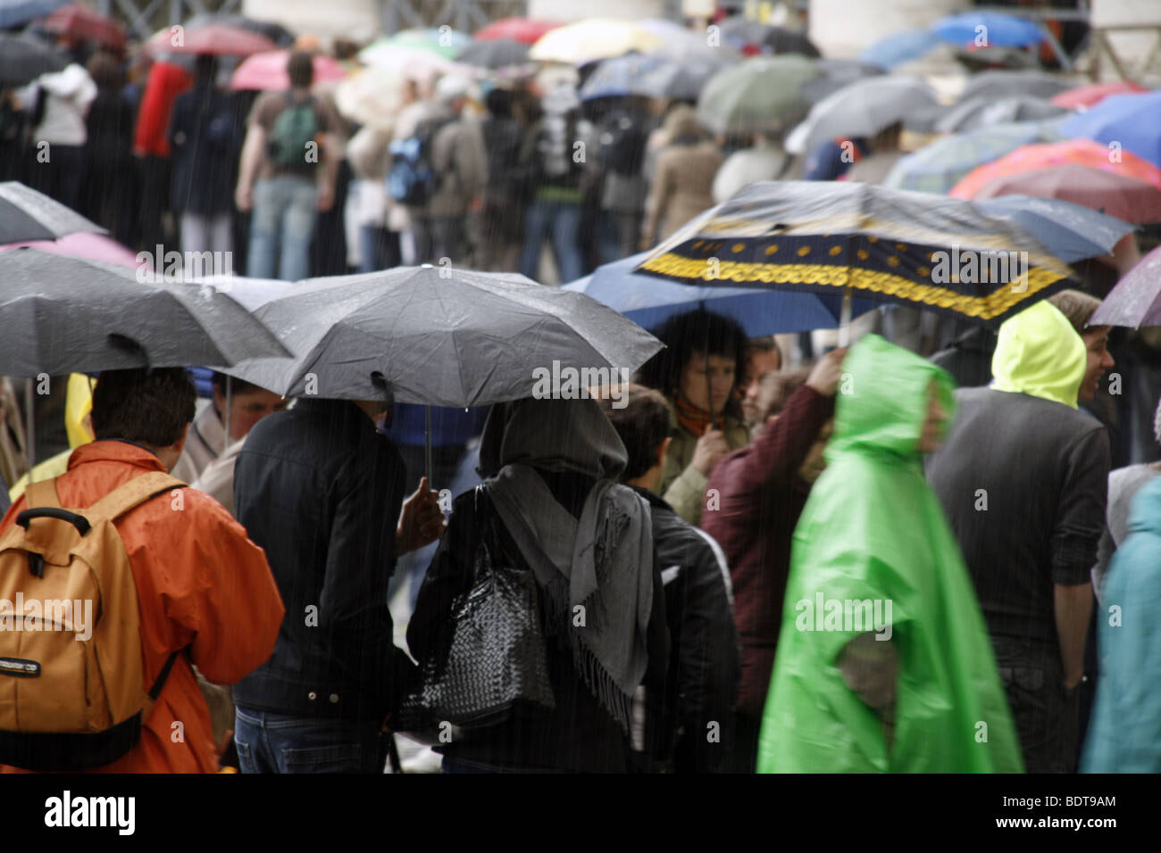 crowd of people with umbrellas in heavy rain in city town Stock Photo ...