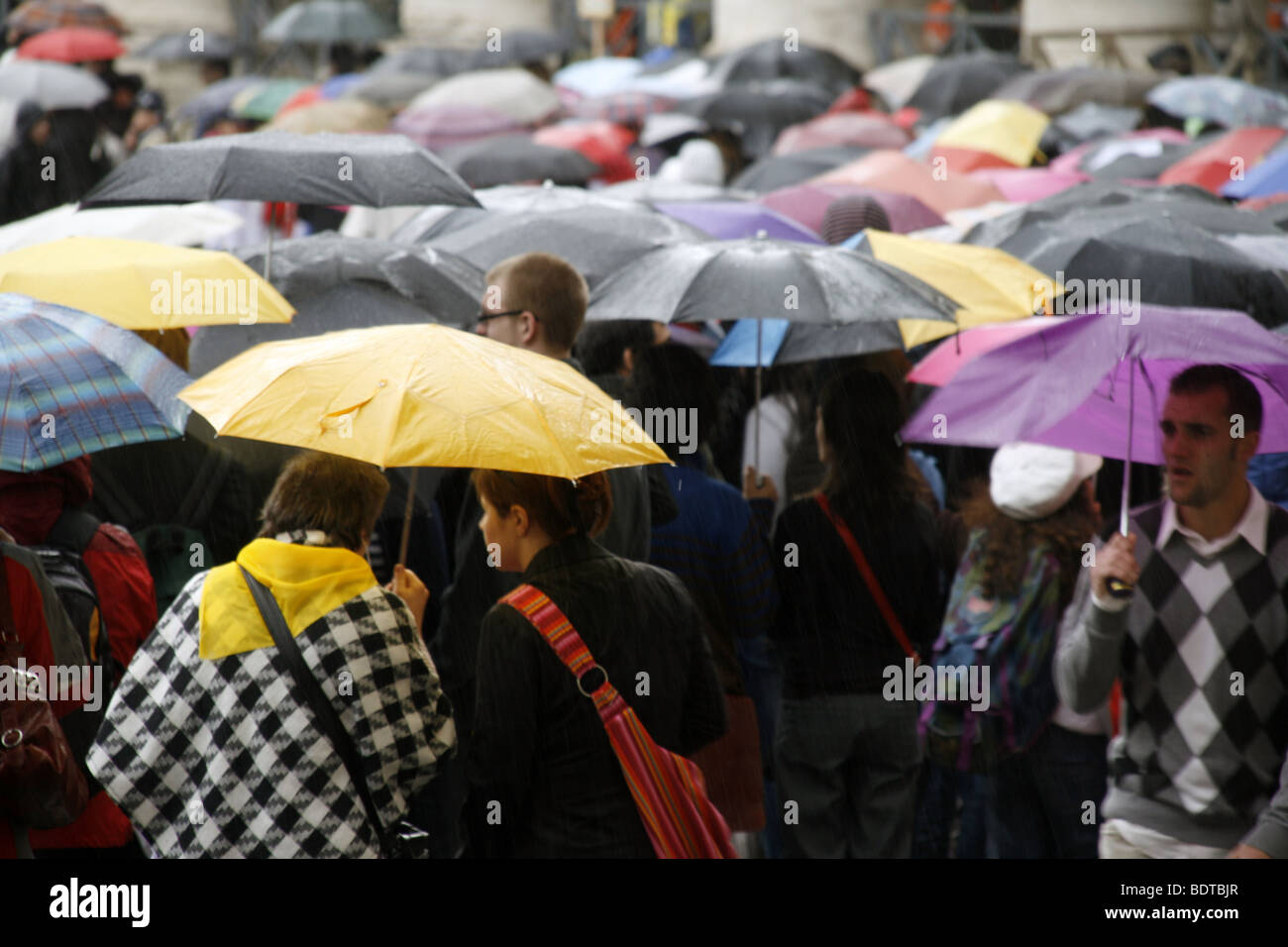 crowd of people with umbrellas in heavy rain in city town Stock Photo ...