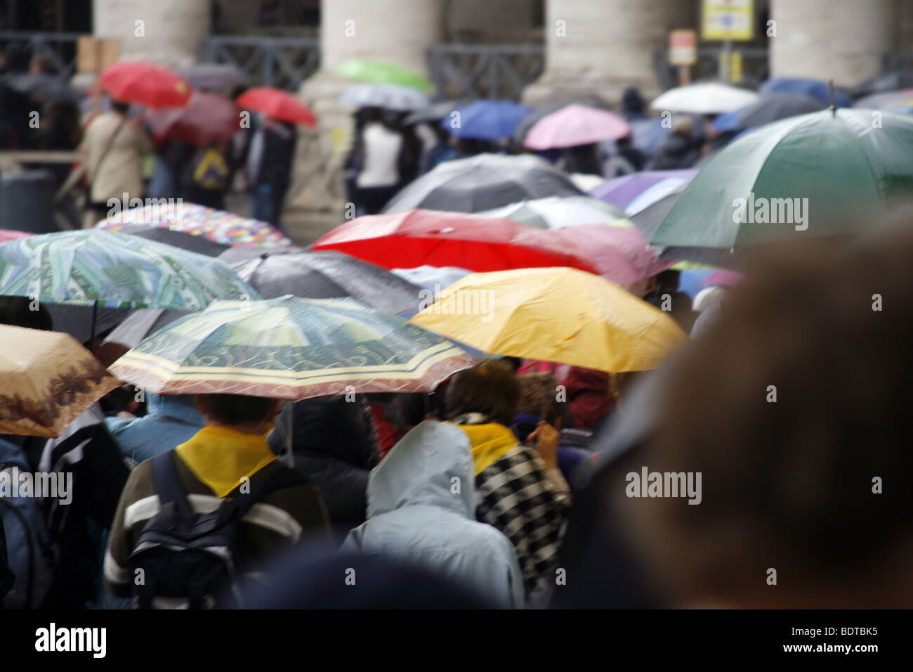 crowd of people with umbrellas in heavy rain in city town Stock Photo ...