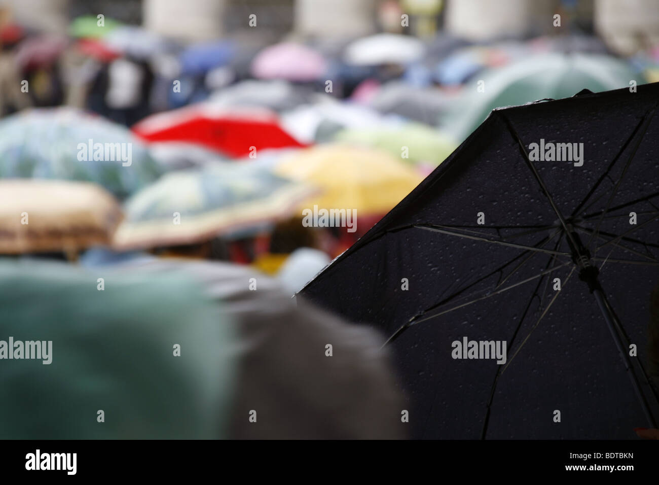 crowd of people with umbrellas in heavy rain in city town Stock Photo ...