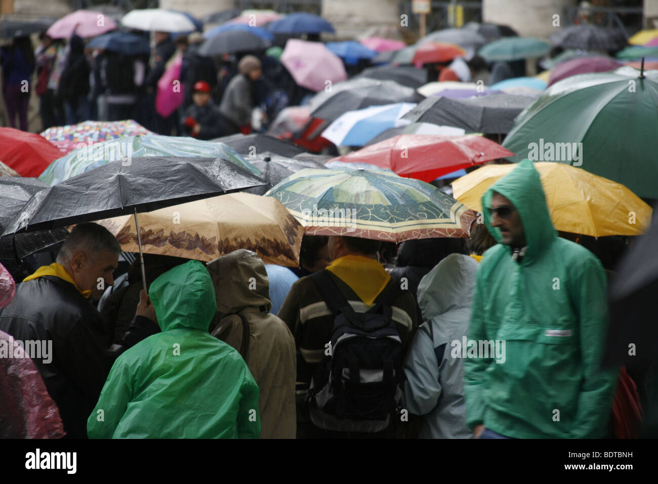 people with umbrellas in heavy rain in city town Stock Photo - Alamy