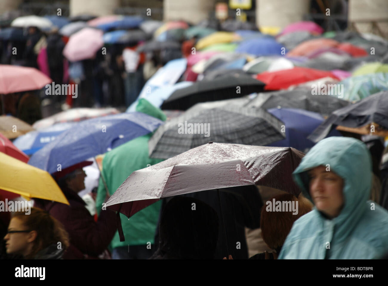 people with umbrellas in heavy rain in city town Stock Photo - Alamy