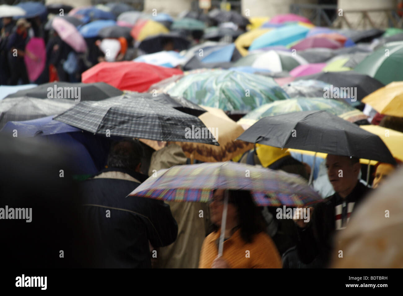 crowd of people with umbrellas in heavy rain in city town Stock Photo ...