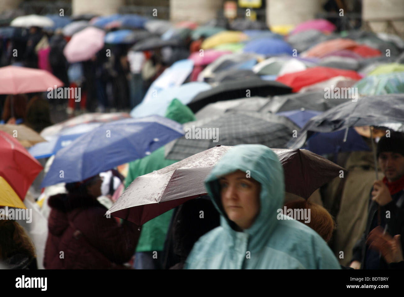 people with umbrellas in heavy rain in city town Stock Photo - Alamy