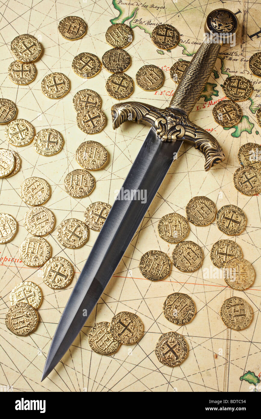 Sword on map with gold coins Stock Photo - Alamy