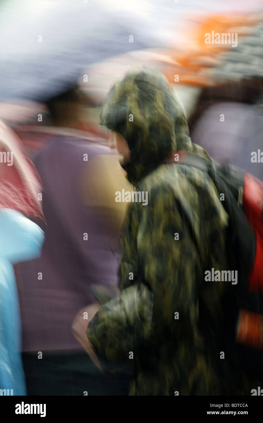 crowd of people in heavy rain in town Stock Photo - Alamy