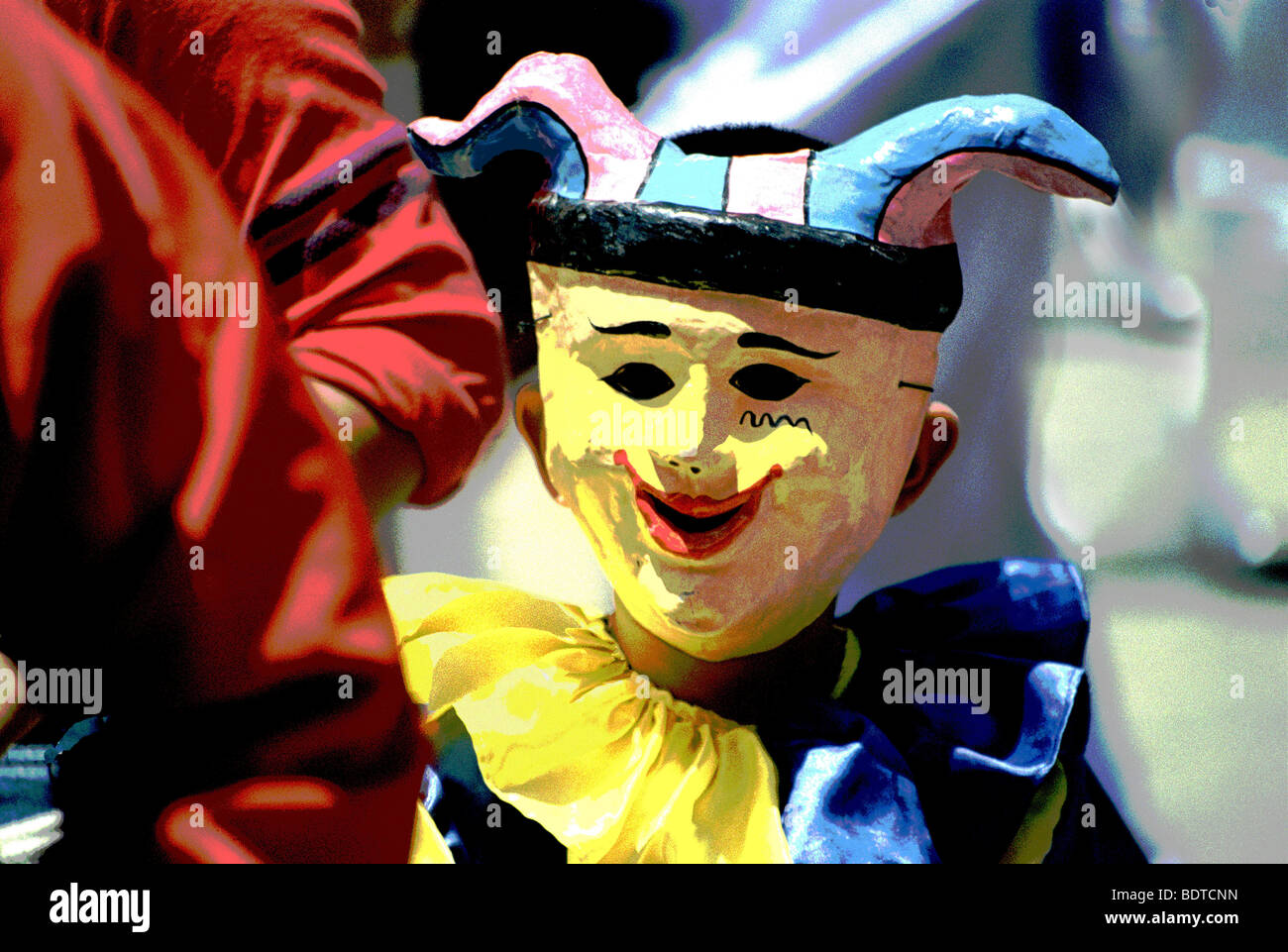 fiesta, festival, or parade scene of people in multi colored costumes ...