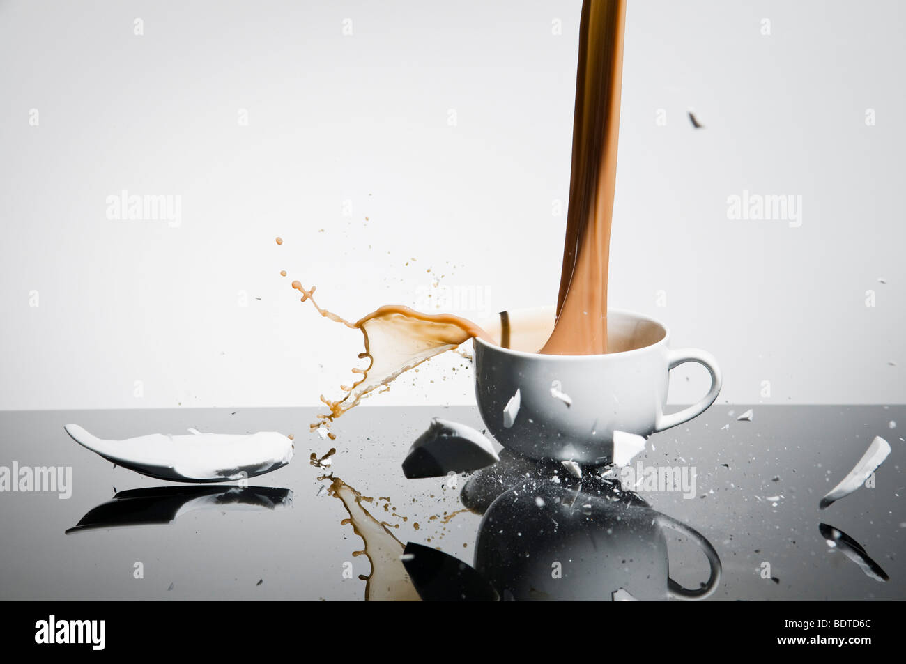 A cup of tea breaking and splashing Stock Photo - Alamy