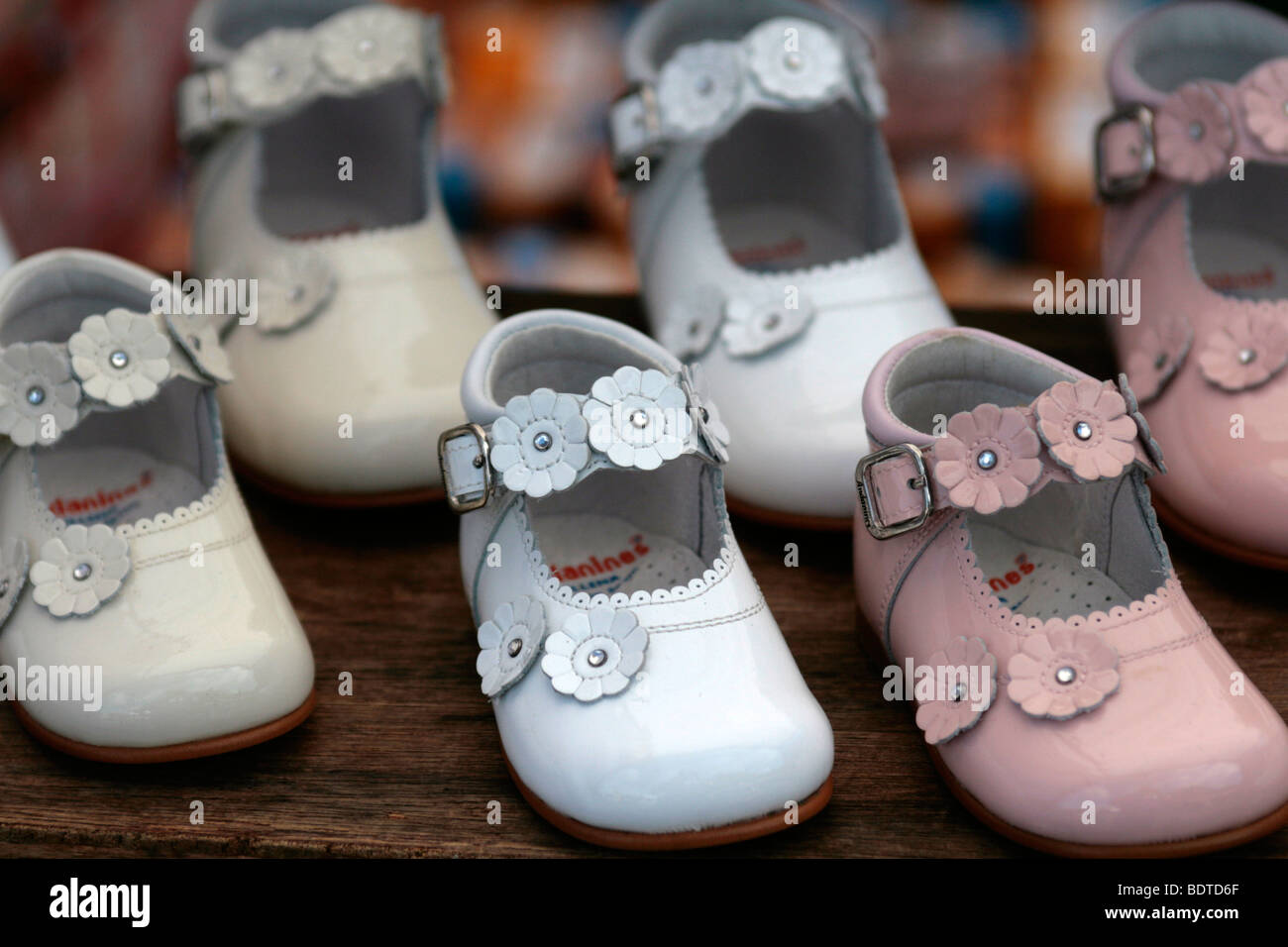 Children's shoes on display at a market Stock Photo - Alamy
