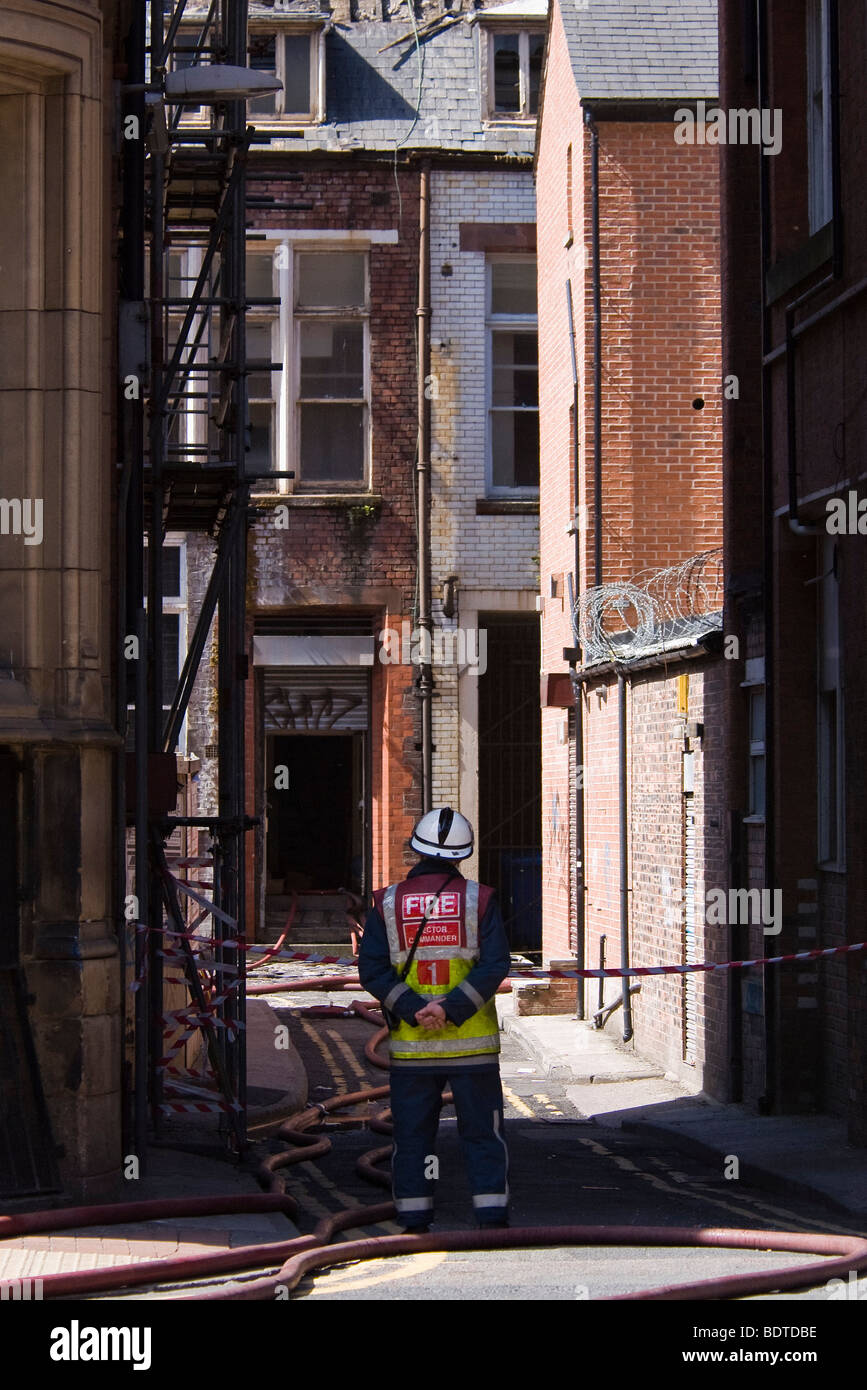 A fireman stares at a burned building after the April 30th, 2007 Dale ...