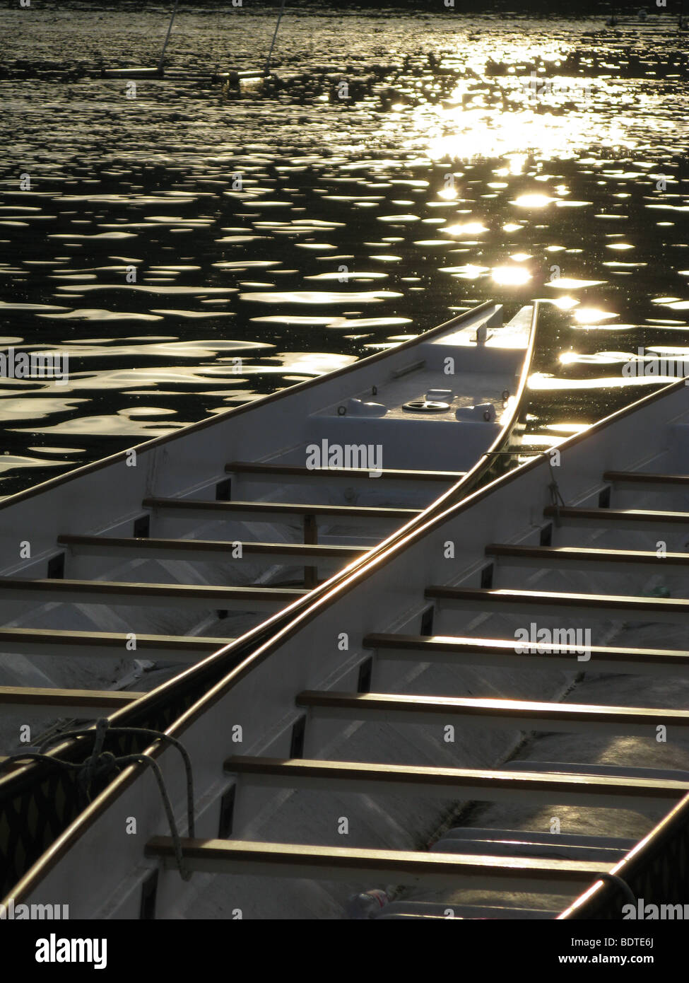 two racing boats by wooden jetty on lake in sun Stock Photo - Alamy