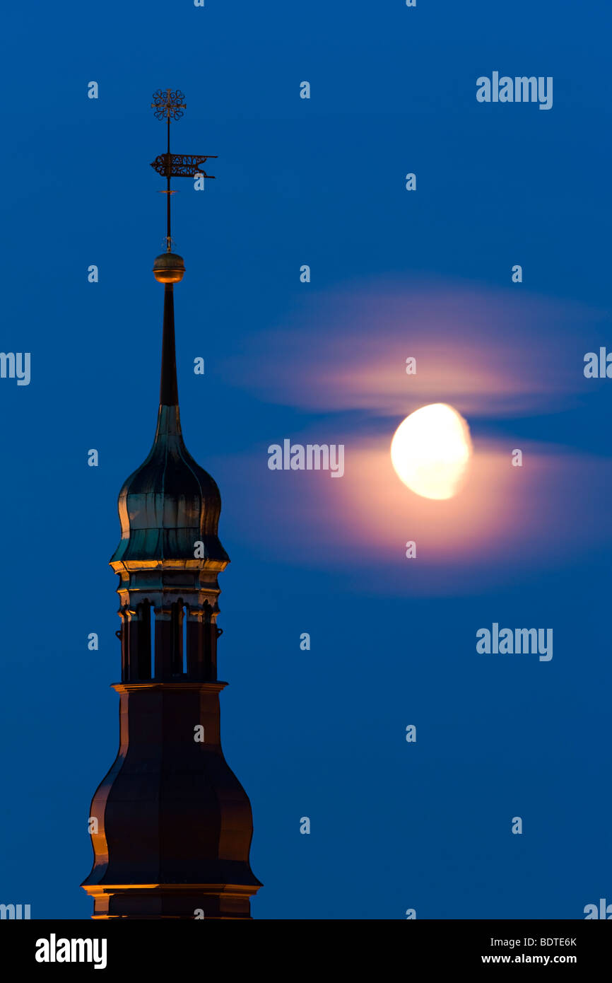Church tower and the moon at night in Tallinn Stock Photo - Alamy