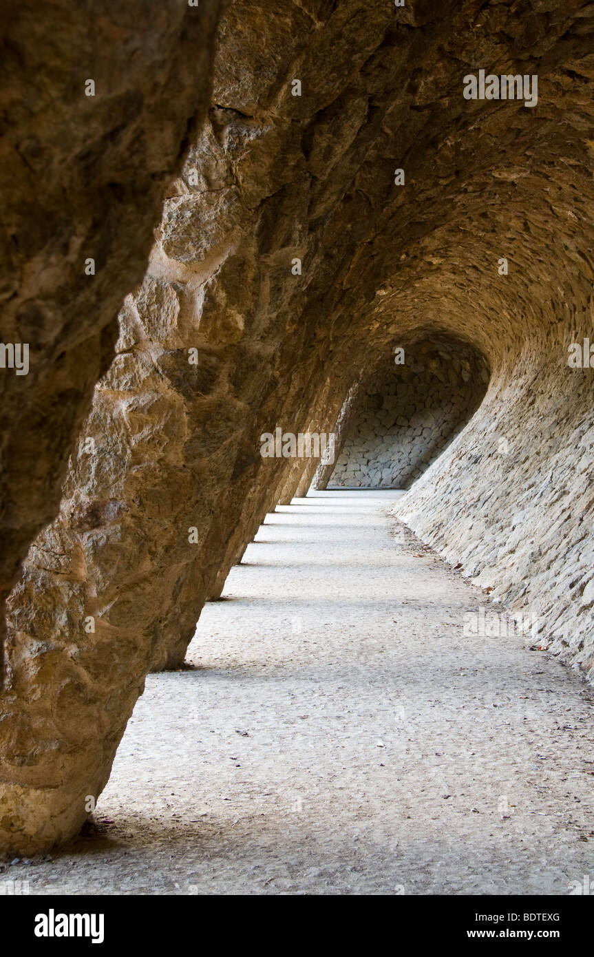 A colonnaded pathway in Park Guell, designed by Antoni Gaudi, in ...