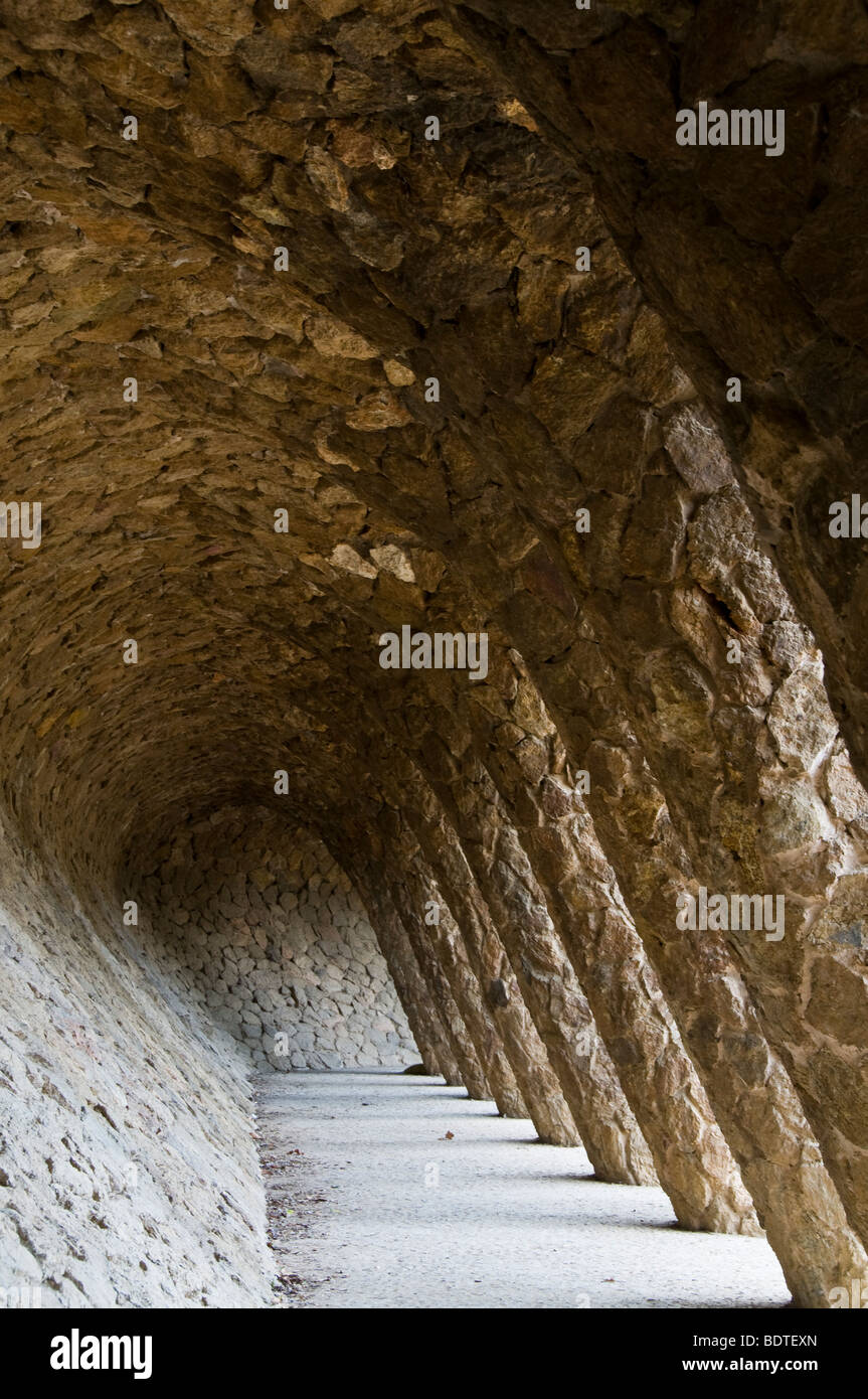 A colonnaded pathway in Park Guell, designed by Antoni Gaudi, in ...