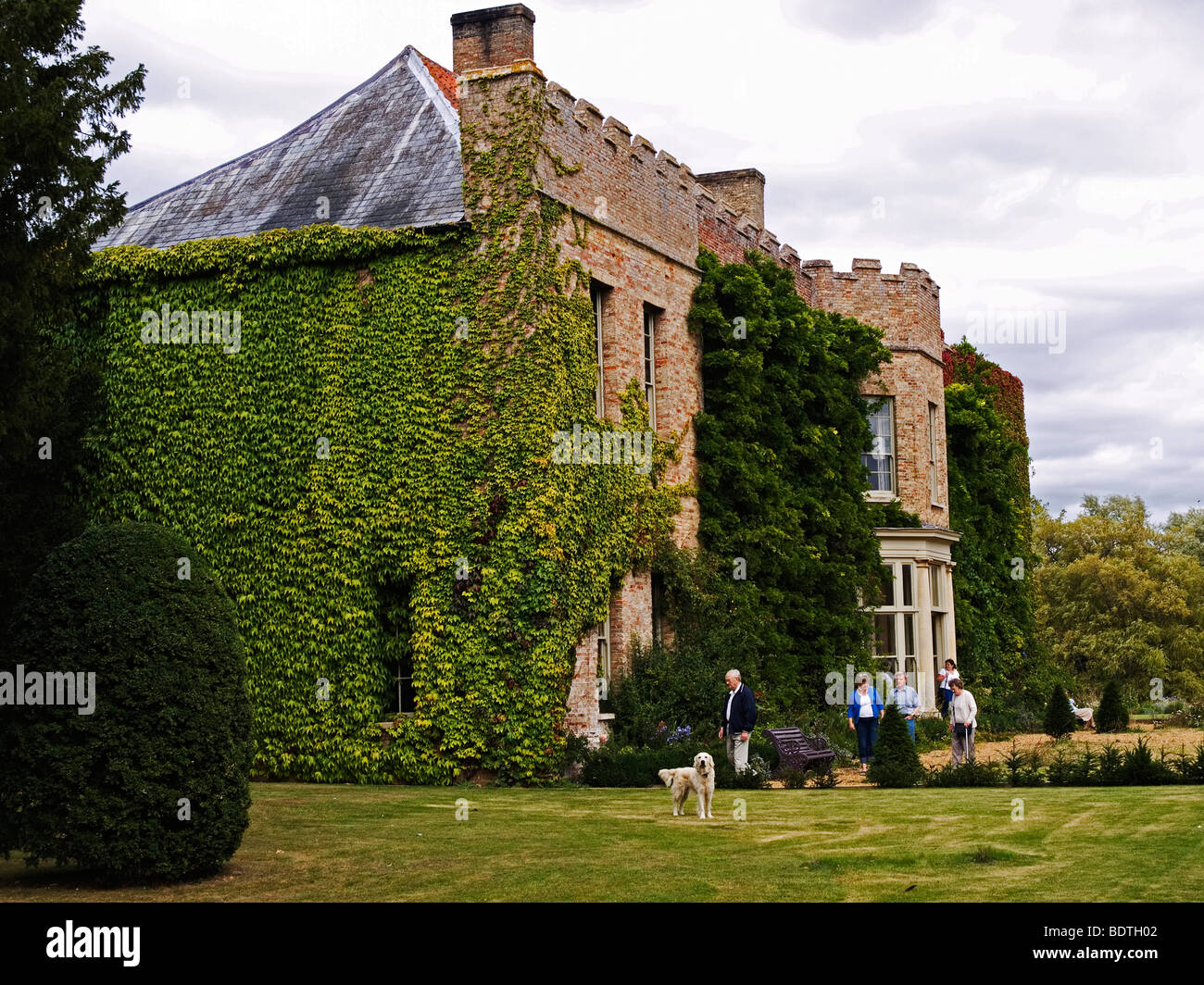 Tourists visiting the gardens in front of Narborough Hall, North ...