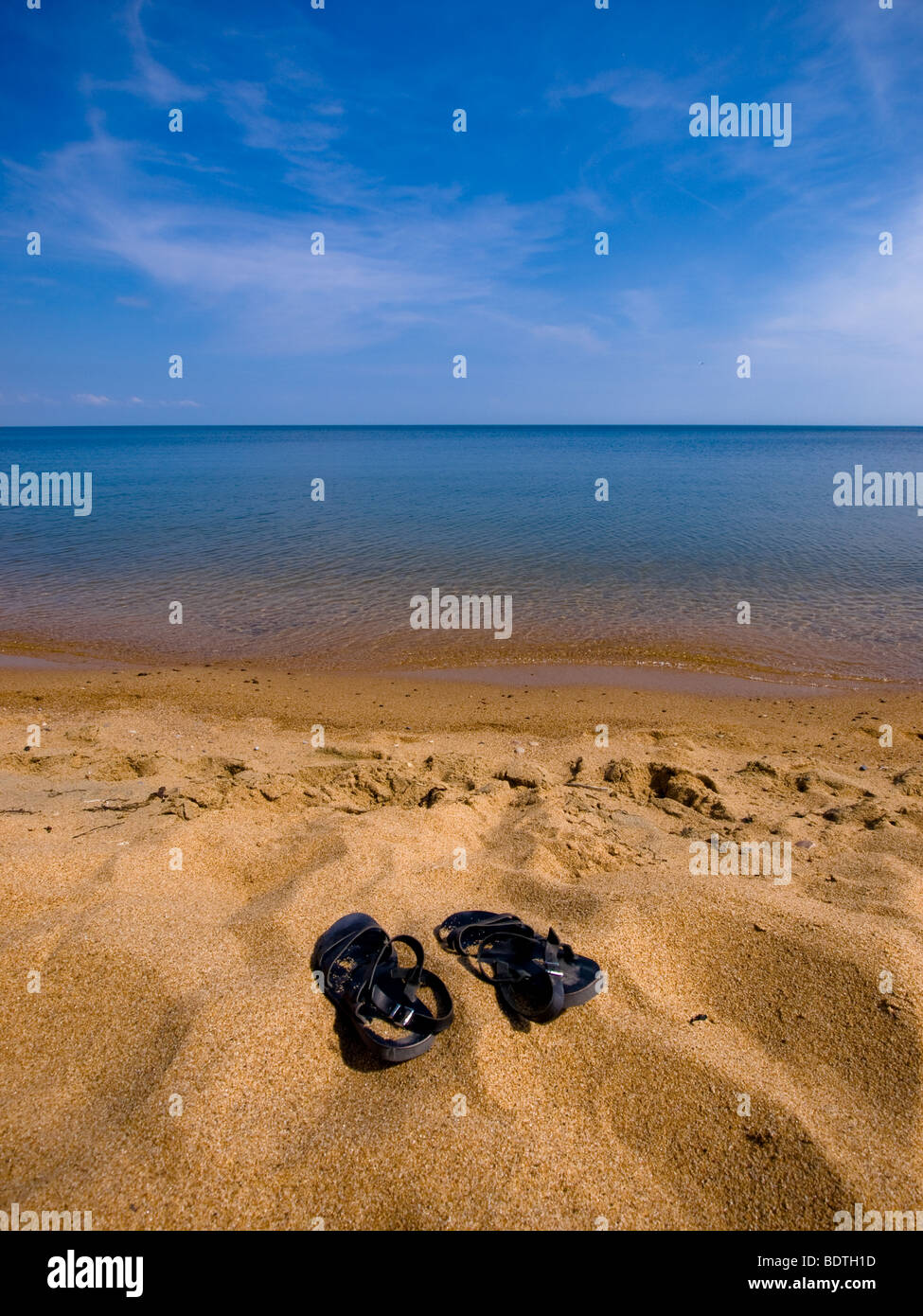 Taking the sandals off at the beach in Simrishamn, Sweden Stock Photo ...