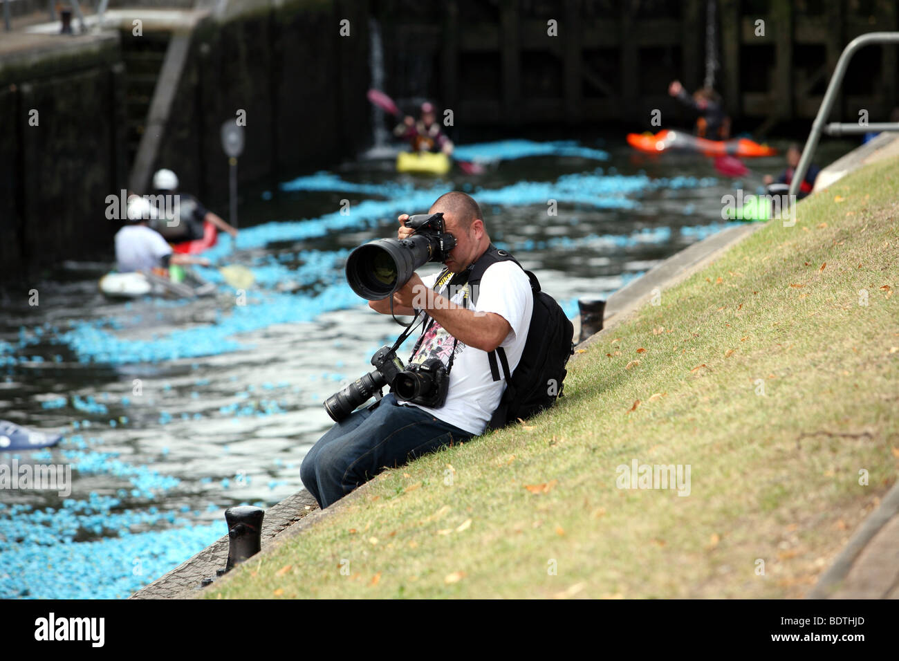 Professional photographer at work at the Great British Duck Race Stock ...